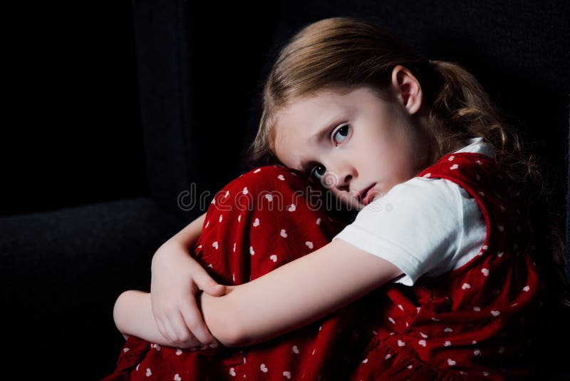 Depressed, Scared Child Sitting in Armchair and Looking at Camera Stock ...