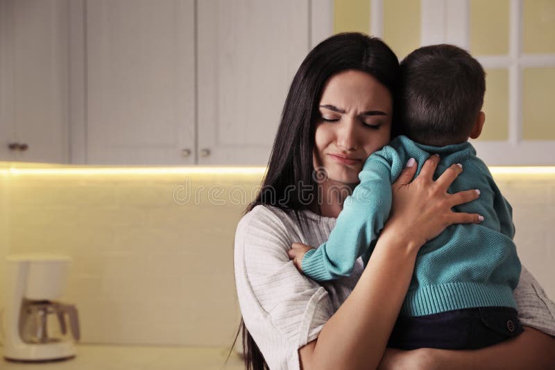 Depressed Single Mother with Child in Kitchen Stock Photo - Image of ...