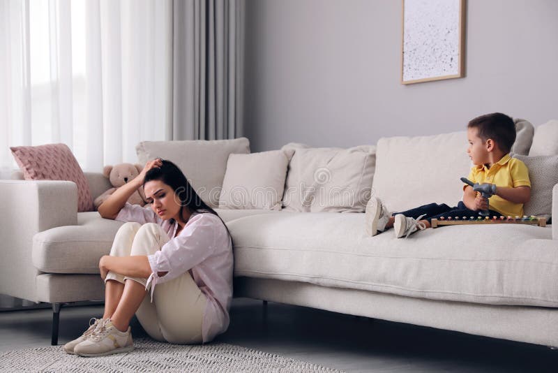 Depressed Single Mother with Child in Room Stock Photo - Image of adult ...