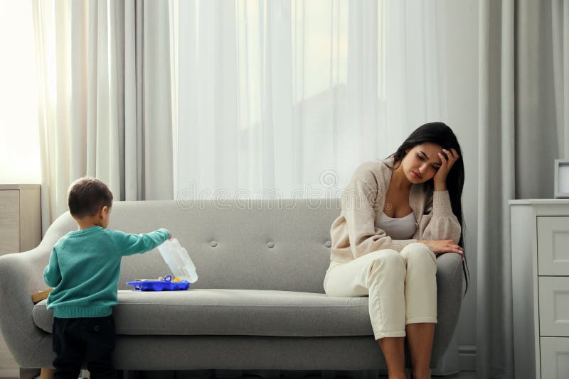 Depressed Single Mother with Child in Room Stock Image - Image of ...