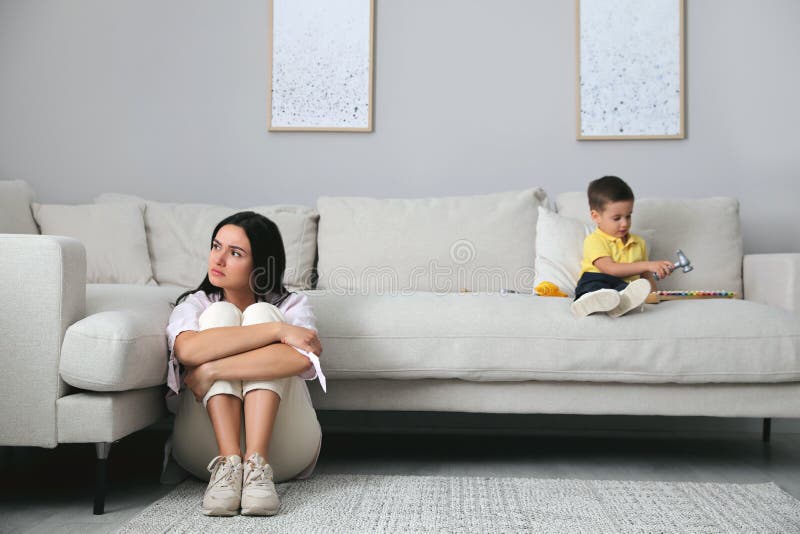 Depressed Single Mother with Child in Room Stock Image - Image of ...