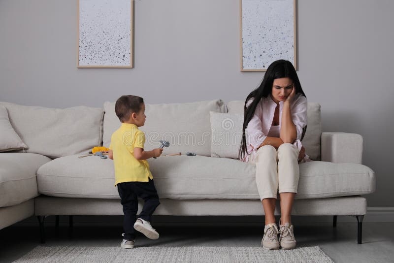 Depressed Single Mother with Child in Room Stock Photo - Image of baby ...