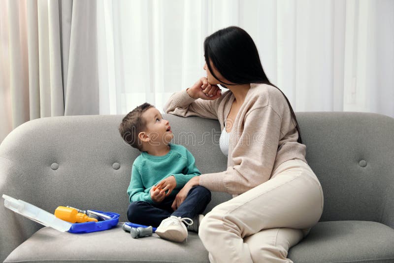 Depressed Single Mother with Child in Room Stock Photo - Image of ...