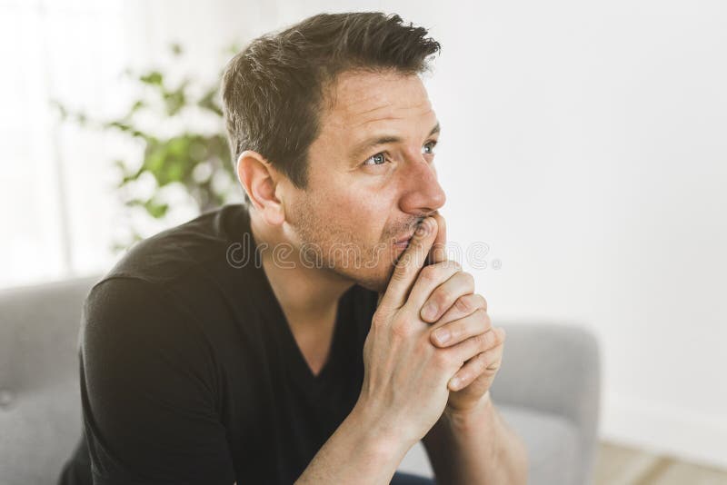 Depressed and Thinking Man Thinking at Home on Couch Stock Photo ...