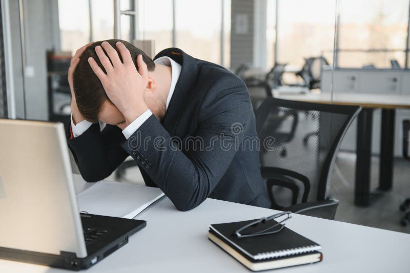 Depressed Young Businessman Holding Head in Hands, Has Problem, a ...