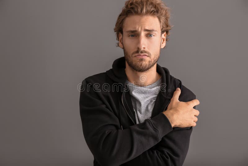 Depressed Young Man on Grey Background Stock Image - Image of depressed ...