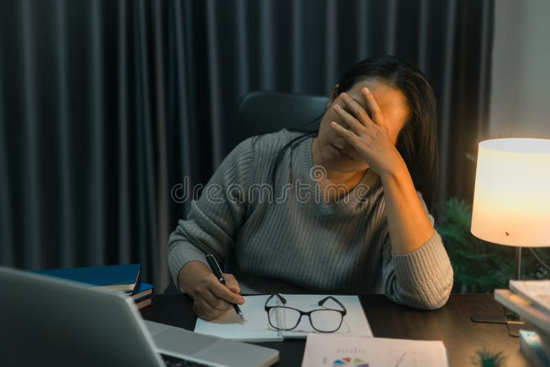 Depression at Work. Asian Businesswoman Sitting and Working Hard at ...