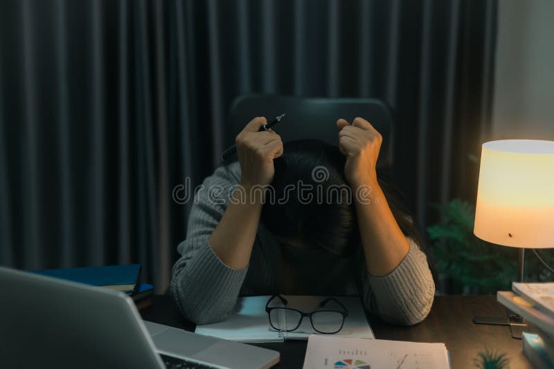 Depression at Work. Asian Businesswoman Sitting and Working Hard at ...