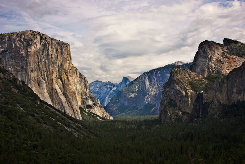 Depth of Yosemite Valley with Beautiful High Peaks and Waterfall Stock ...