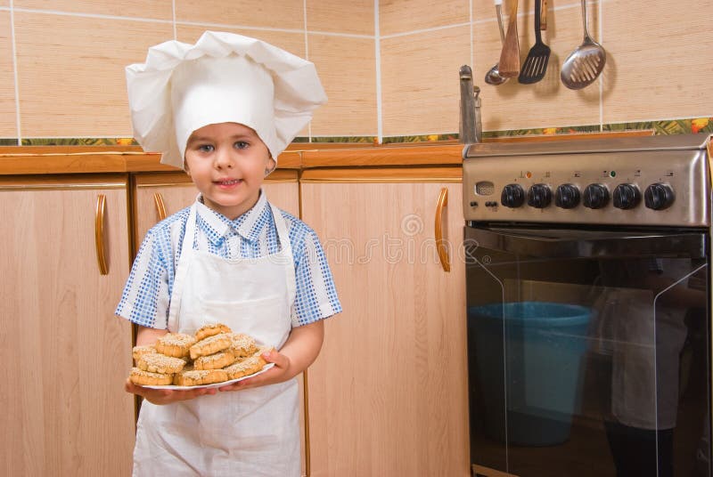 Der kleine Koch stockfoto. Bild von plätzchen, kind, uniform - 12282990
