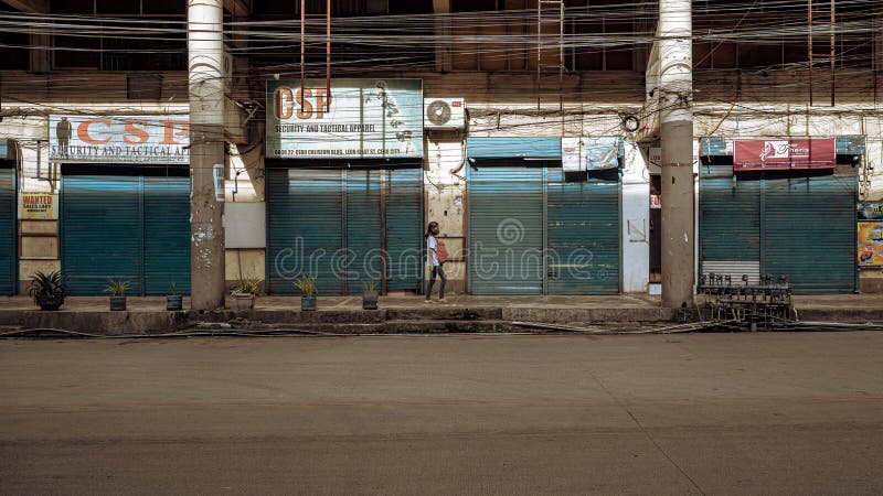 A Building with Many Empty Closed Shops and Graffiti on the Side ...