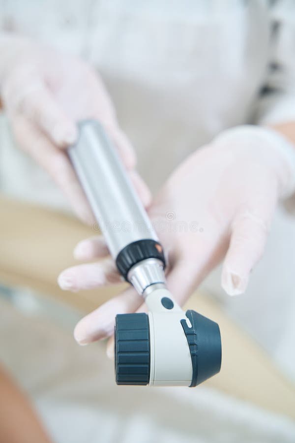 Dermatologist Holding a Dermoscope in His Hands Stock Photo - Image of ...