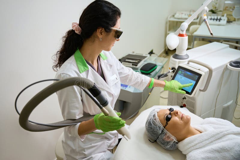 Dermatologist Sets Up Modern Equipment for Work Stock Image - Image of ...
