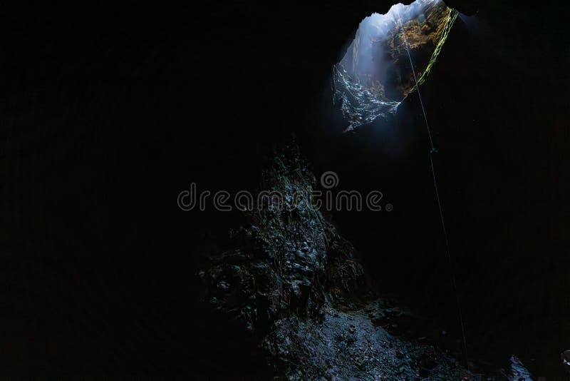 Descending into the Darkness of a Huge Cave Stock Image - Image of ...
