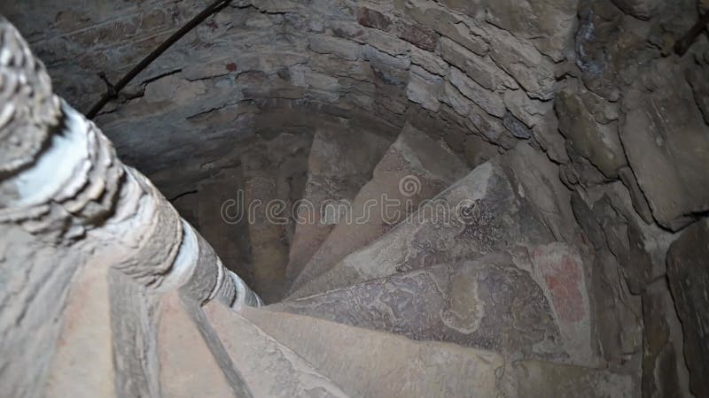 Descending the Spiral Staircase To the Dungeon. Ancient Stone Staircase ...