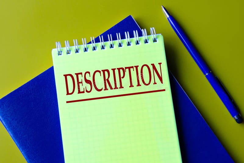 DESCRIPTION - Word in Yellow Notebook on Blue Notebook and Pen ...
