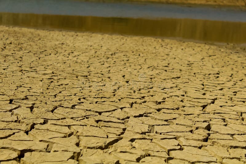 Desert Against the Ground with Cracks with Water Level Down Stock Image ...