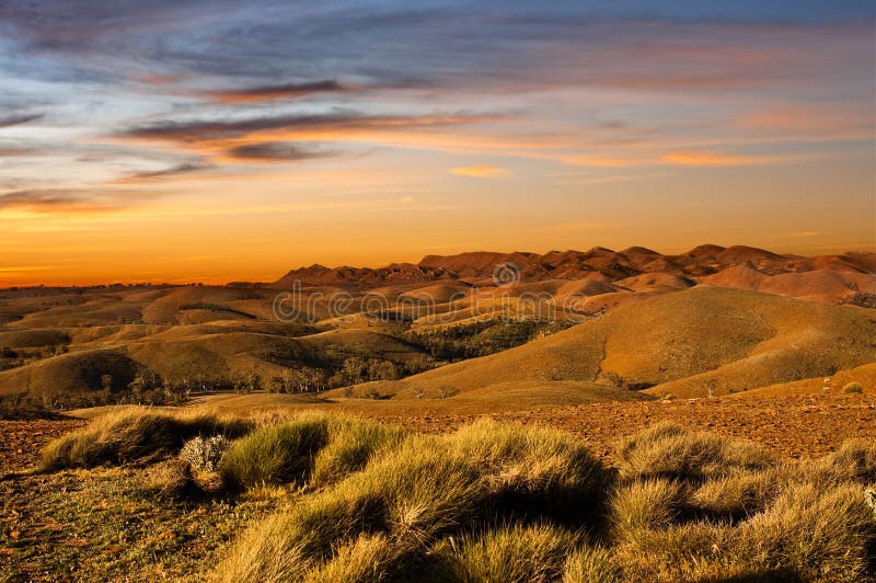 Desert land sunset stock image. Image of bush, hill, ochre - 16375169