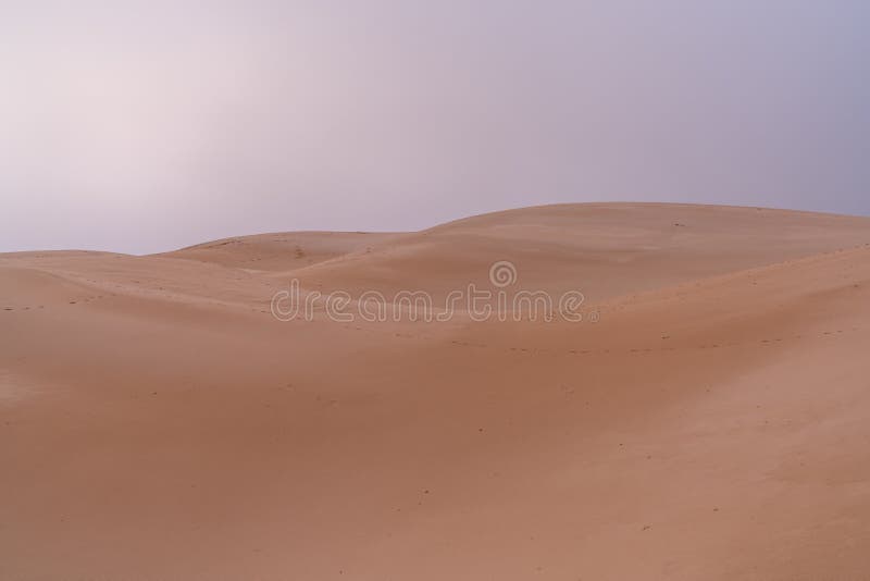 Desert Landscape and Large Sand Dune with Under an Overcast Evening Sky ...