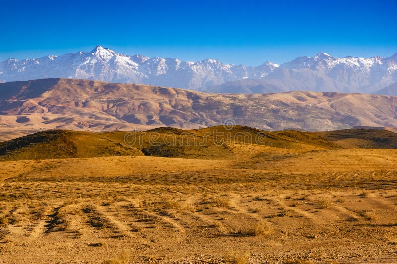 A Desert Landscape with a Mountain in the Background Stock Photo ...