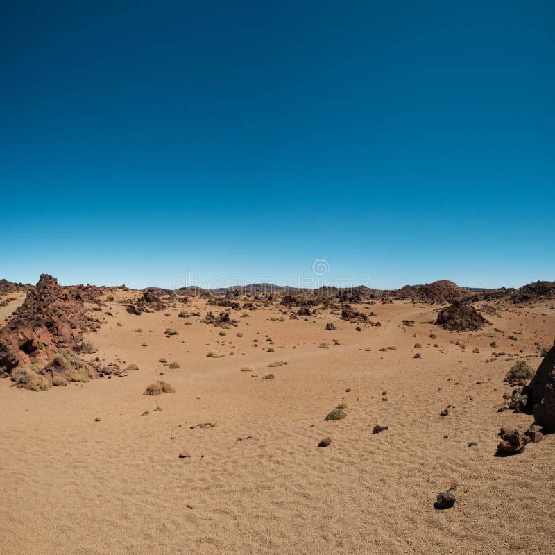 Desert Landscape with Volcanic Rocks and Blue Sky - Stock Image - Image ...