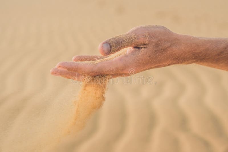 Desert, Sand Puffs through the Fingers of a Man`s Hand Stock Image ...