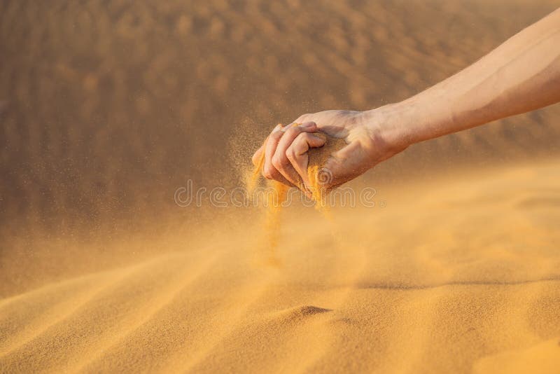 Desert, Sand Puffs through the Fingers of a Mans Hand Stock Photo ...