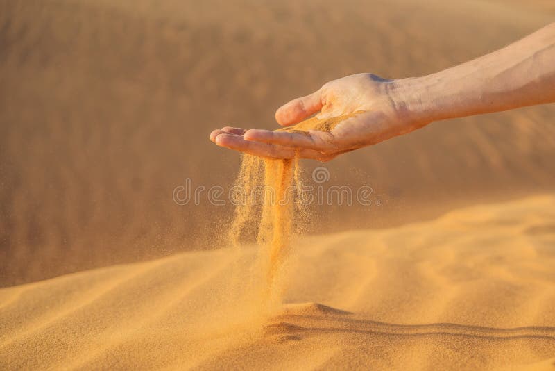 Desert, Sand Puffs through the Fingers of a Mans Hand Stock Photo ...