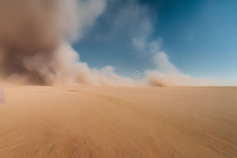 A Desert Scene with a Large Cloud of Dust in the Distance Stock Photo ...