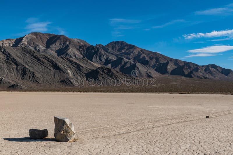 Desert Scene with a Long Trace Left by Two Stones on the Dry Ground and ...
