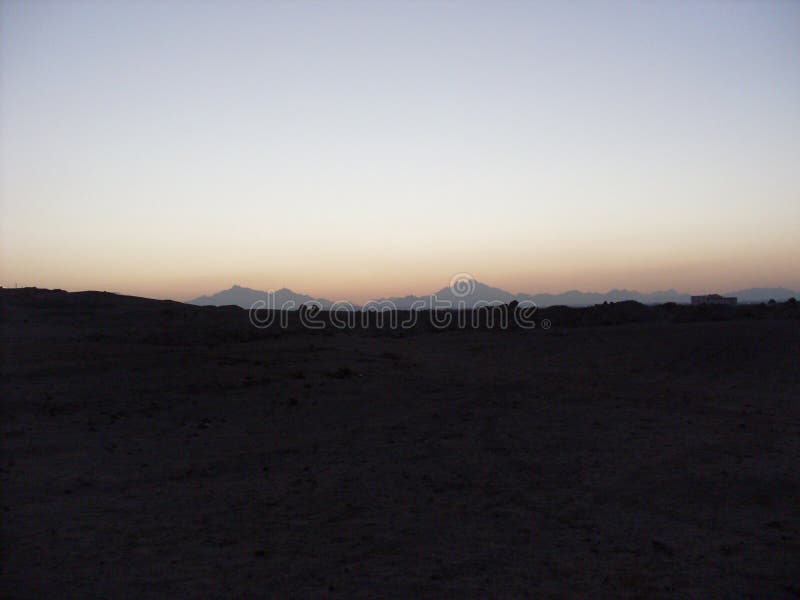 Desert in the Sunset and Big Mountain on the Horizon Stock Image ...