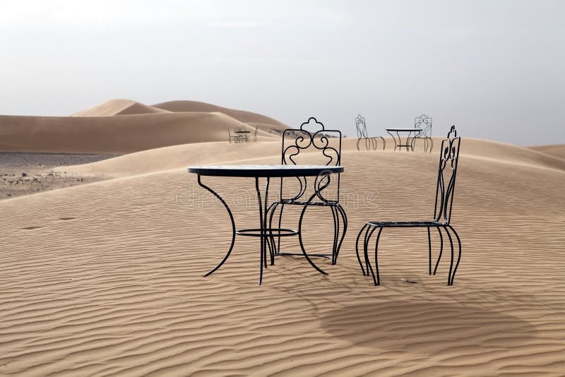 Chairs And Table In The Sand Of The Desert Stock Photo - Image of empty ...