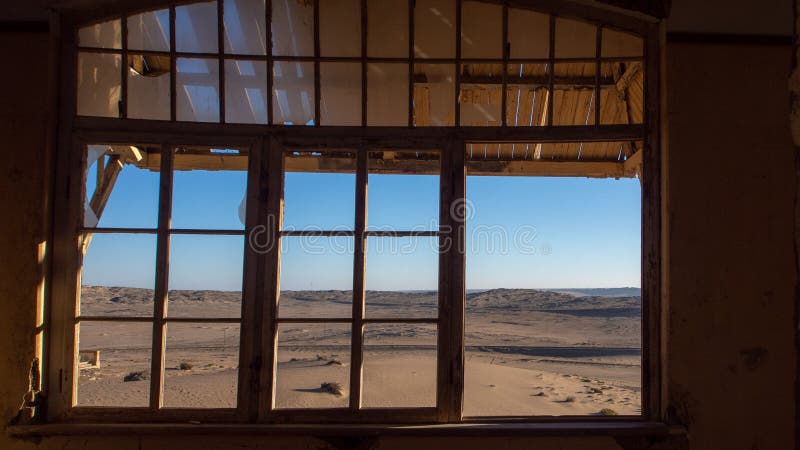 Desert View through on of the Neglected Window Frames of a House at the ...
