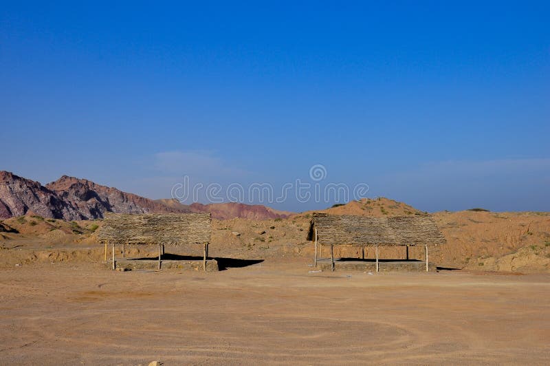 Deserted Area Covered with Dried Grass, Mountains and Wood Crosses with ...