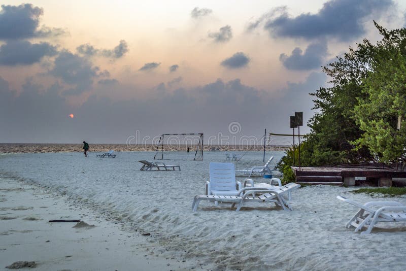 A Deserted Beach with Sunbeds at Sunset Stock Image - Image of tropical ...
