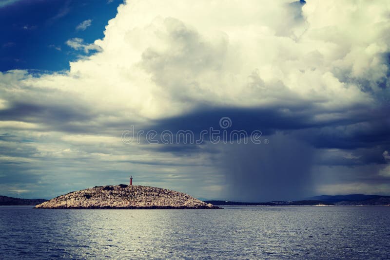 Deserted Island and a Storm Stock Photo - Image of uninhabited, blue ...