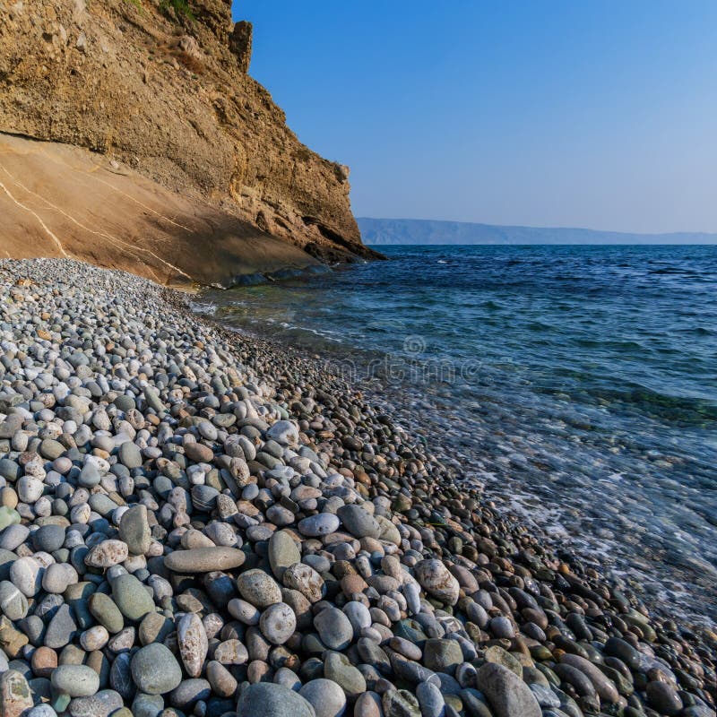 Deserted Sea Shore with Pebbles on a Sunny Day Stock Image - Image of ...