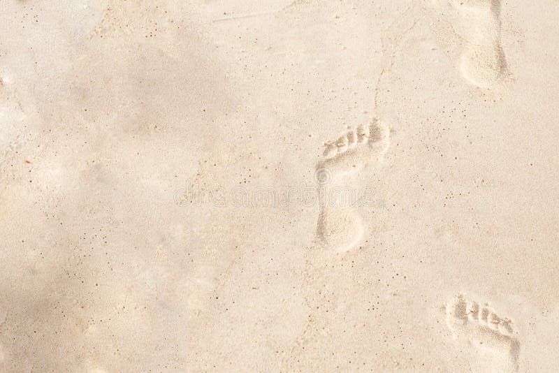 Design Base Set of Footprints on Beige Sand Go Up Copy Space Stock ...