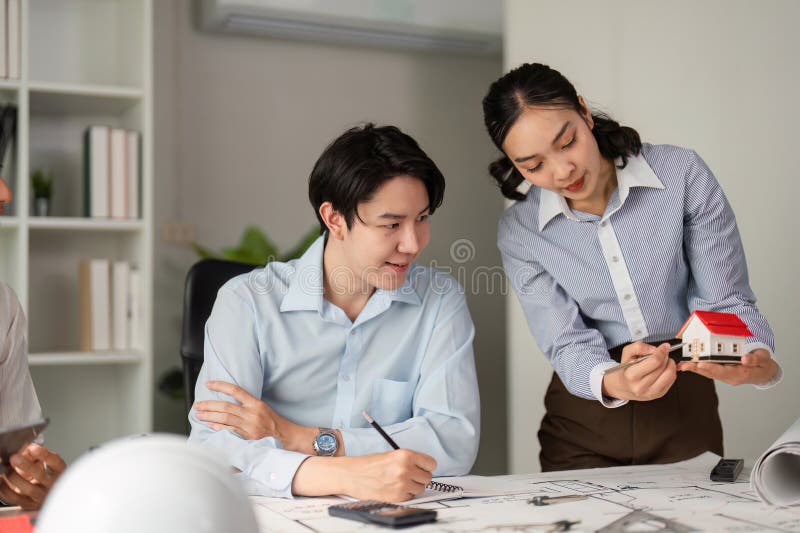 Design Collaboration and Problem Solving. Team Members Reviewing ...