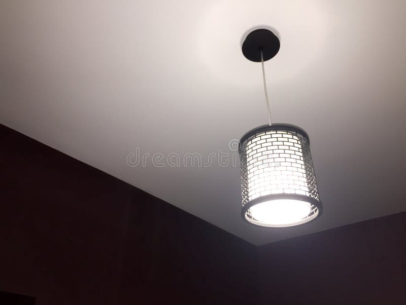 Design Loft Lamp with Dim Light and Mesh Housing Stock Photo - Image of ...