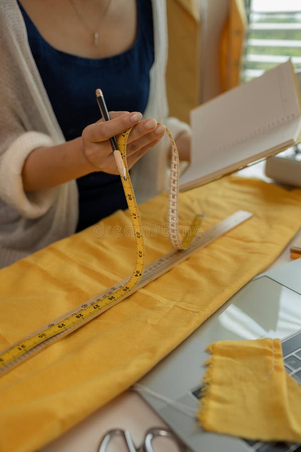 Design Professional Marking on Fabric, Designer Working in the Studio, Tailor Adjusts Garment ...