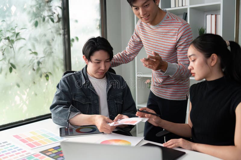 Design Review and Team Synergy. a Team Evaluating Design Concepts and ...