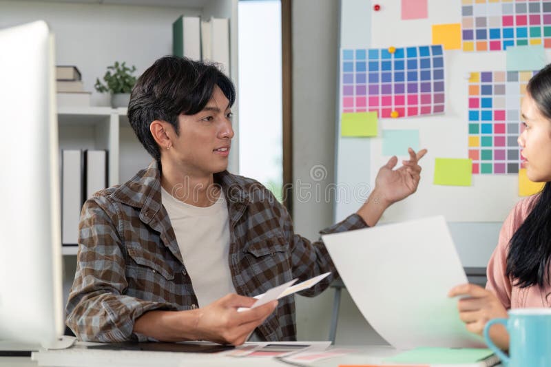 Creative Design Team Discussing Graphics Strategy in Modern Office ...