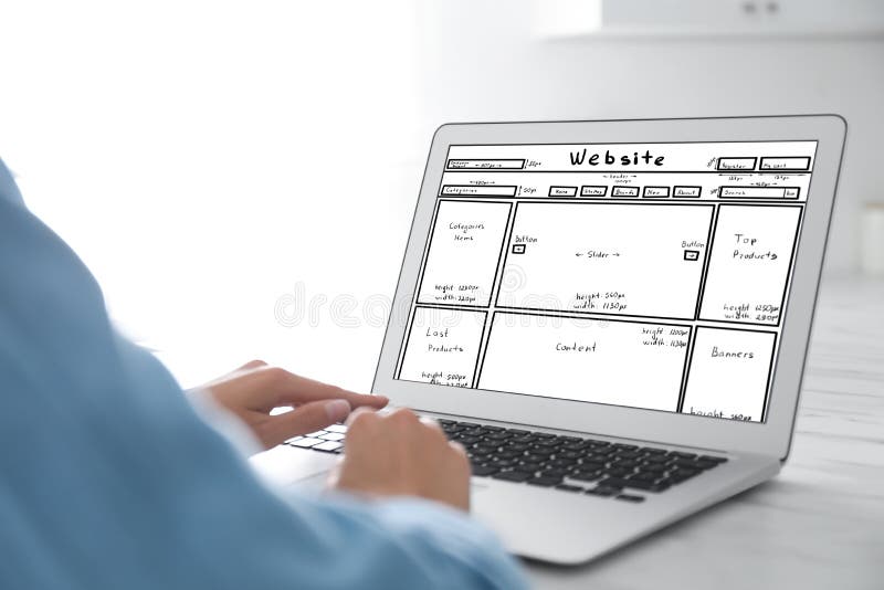 Designer Creating Website on Laptop at White Table, Closeup Stock Photo ...