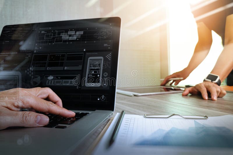 Designer Hand Working with Digital Tablet Computer and Smart Phone on ...