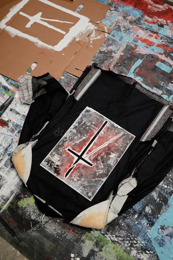 Designer Jacket Placed on Floor for Drawing Cross Shaped Print Using ...