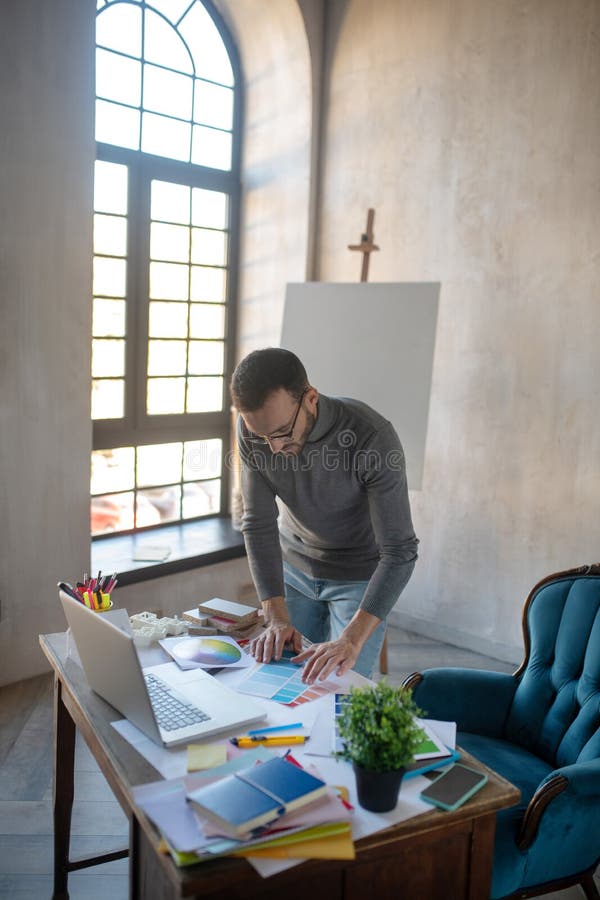 Interior Designer Standing Near Table Having a Lot of Tasks Stock Image ...