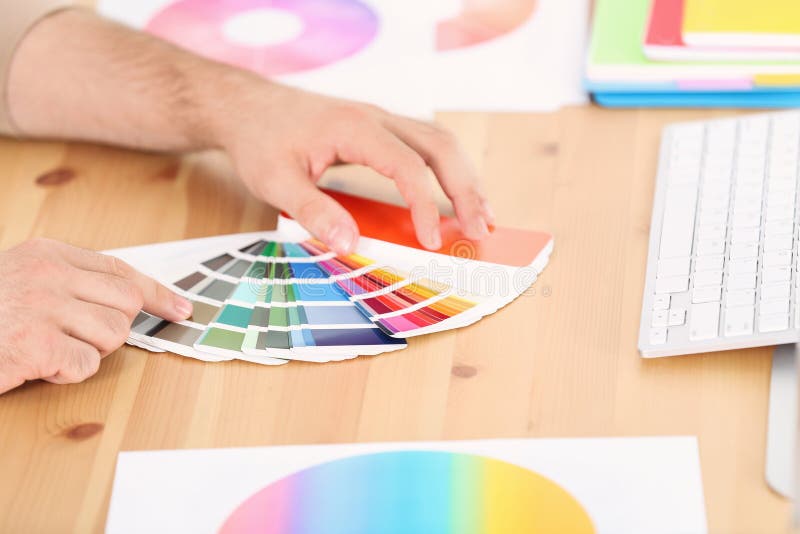 Designer with Paint Color Palette Samples at Table Stock Photo - Image ...