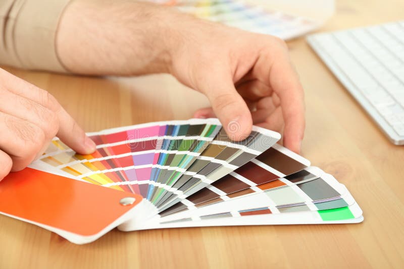 Designer with Paint Color Palette Samples at Table Stock Photo - Image ...