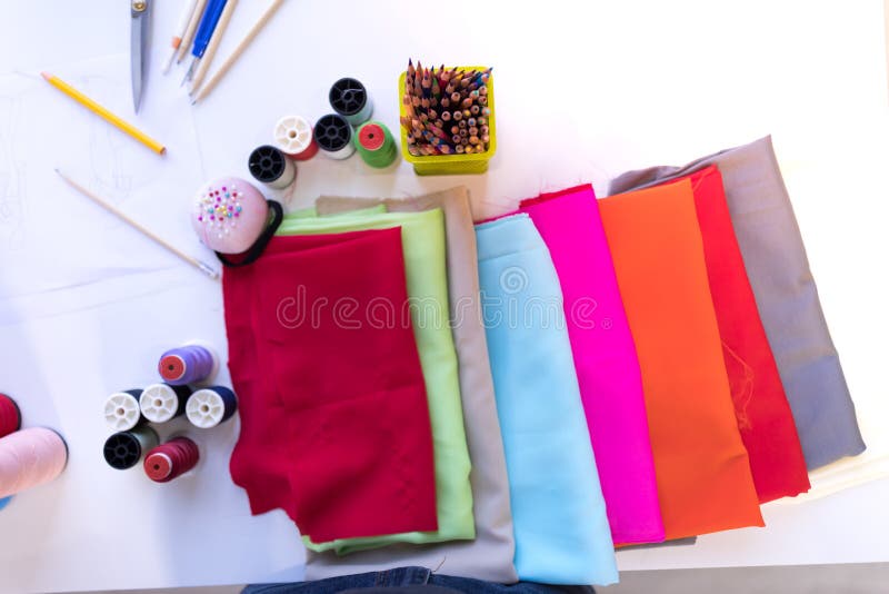 Designer Sewing Tools, Fabric Thread, Pins and Colored Pencils on the ...